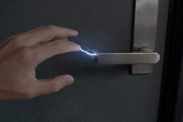 Why does it happen to take the shock when we touch something?